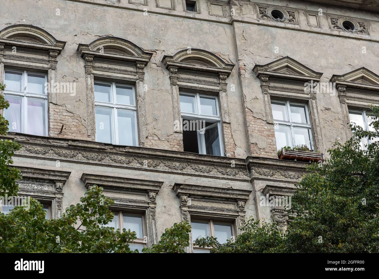 An old window is open and the trees are green Stock Photo - Alamy