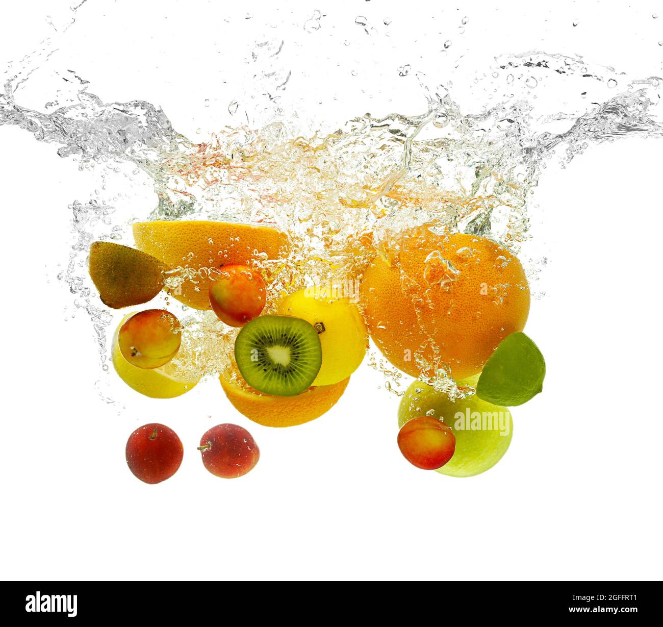 Fruits falling into water on white background Stock Photo - Alamy