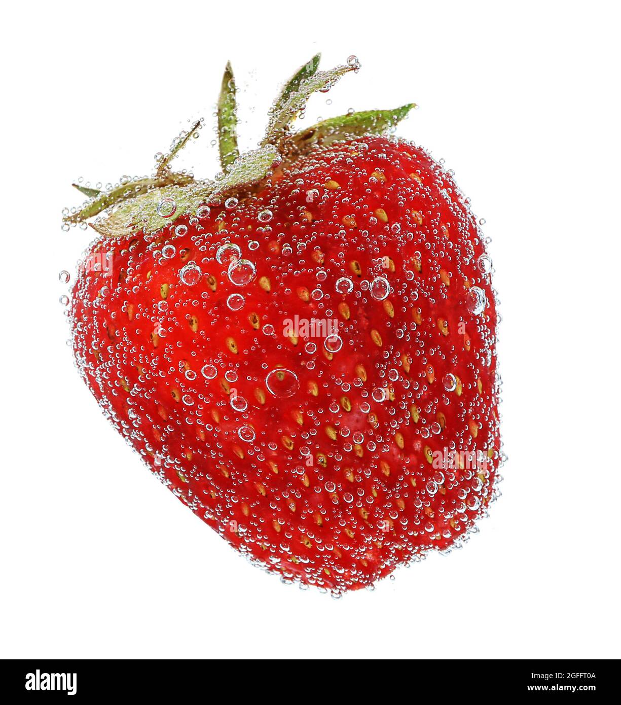 Strawberry in a water on white background Stock Photo - Alamy