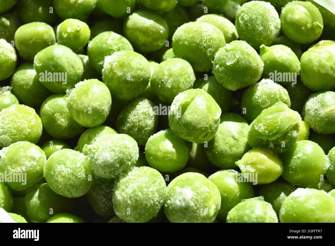 Fresh green frozen peas and grains, nutritious and healthy green ...