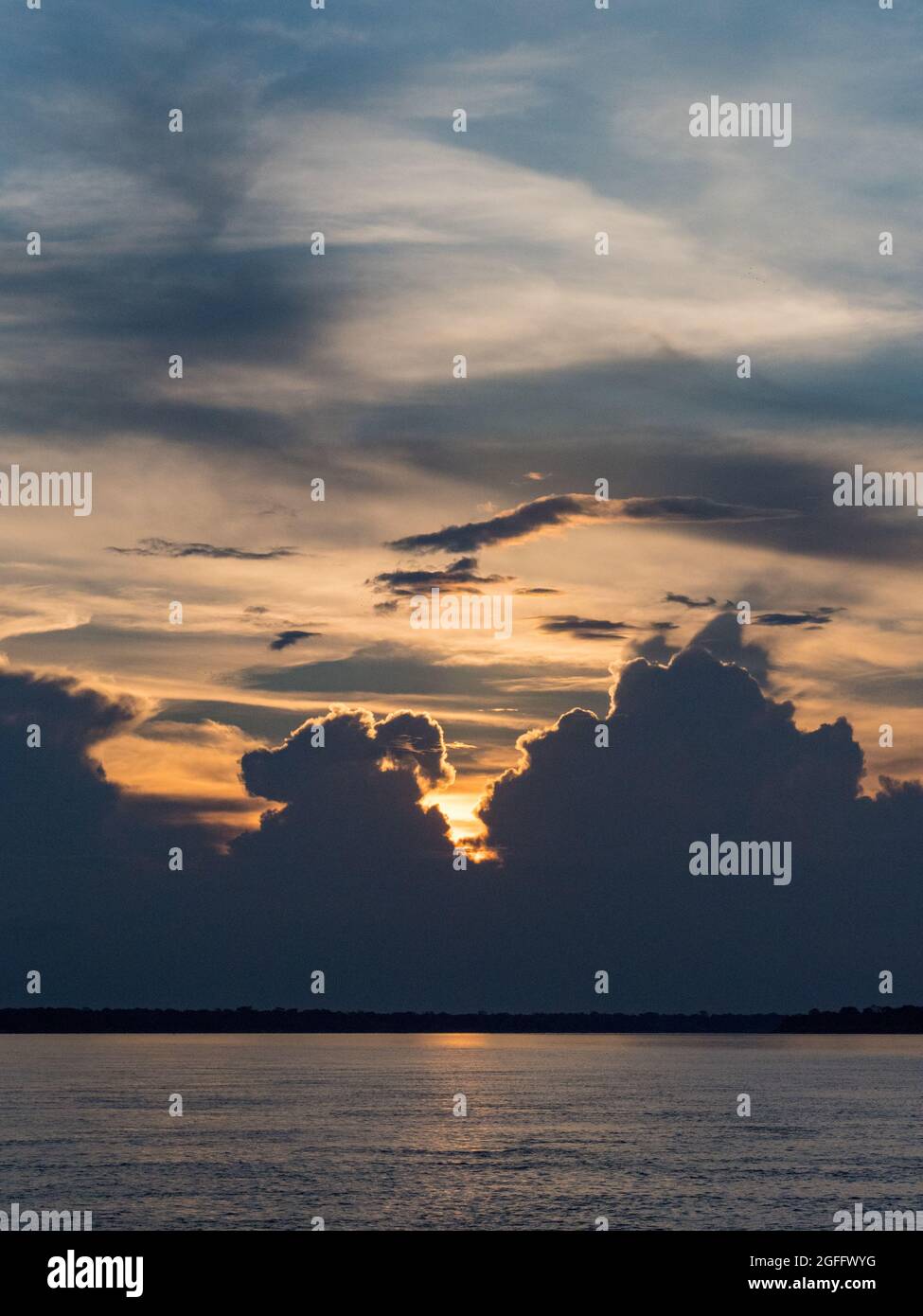 Magic sunset with beautiful clouds over the Amazon river. Amazonia ...