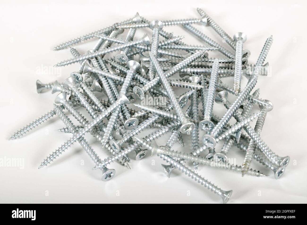 Chrome metal screw and on isolated white background, crosshead screw ...