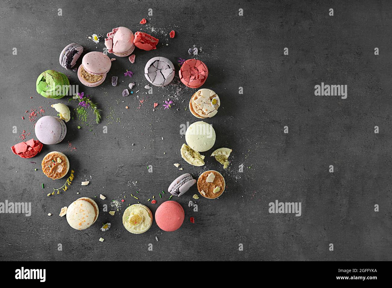 Circle of different colorful macaroons on gray background Stock Photo ...