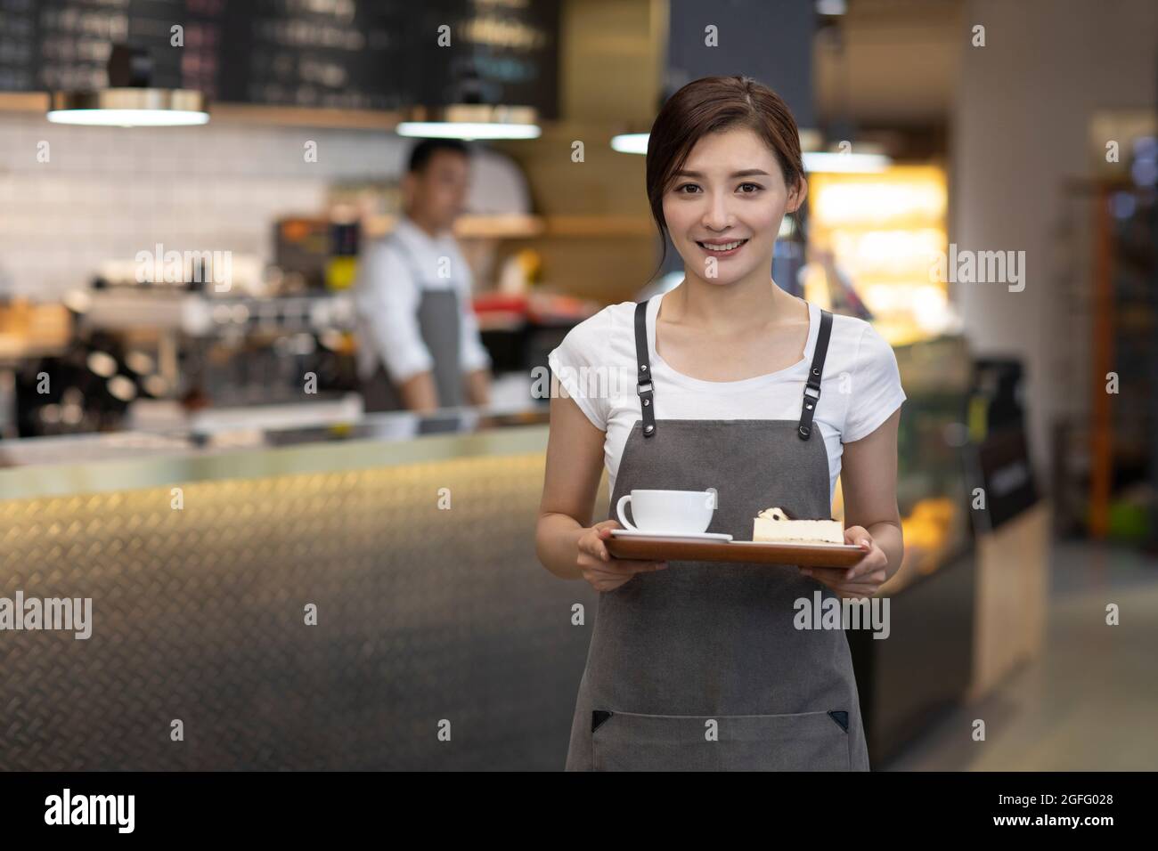 Couple in coffee shop waitress hi-res stock photography and images - Alamy