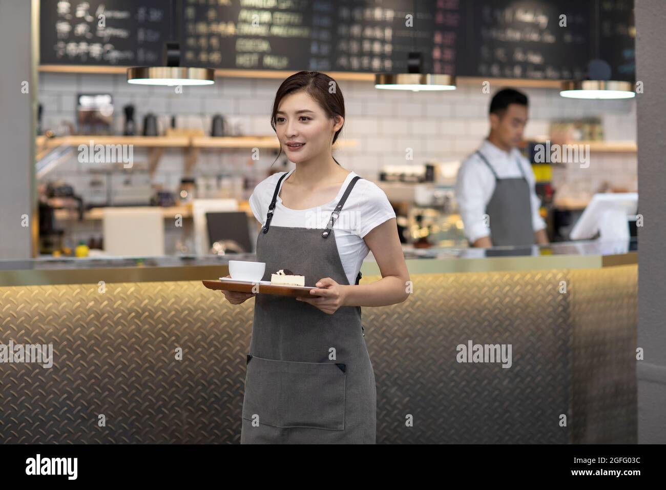 Couple in coffee shop waitress hi-res stock photography and images - Alamy
