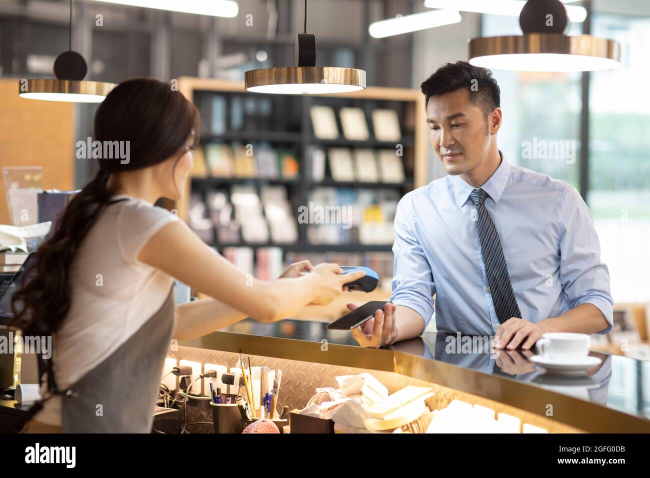 Businessman paying smart phone hi-res stock photography and images - Alamy