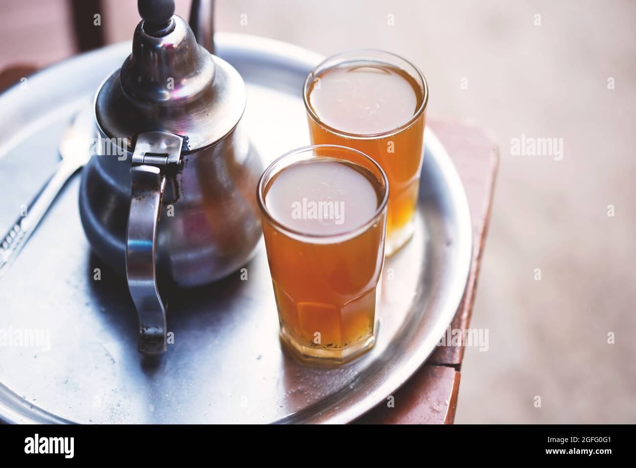 Moroccan tea, kettle and glass of fresh tea, Essaouira, Morocco Stock ...