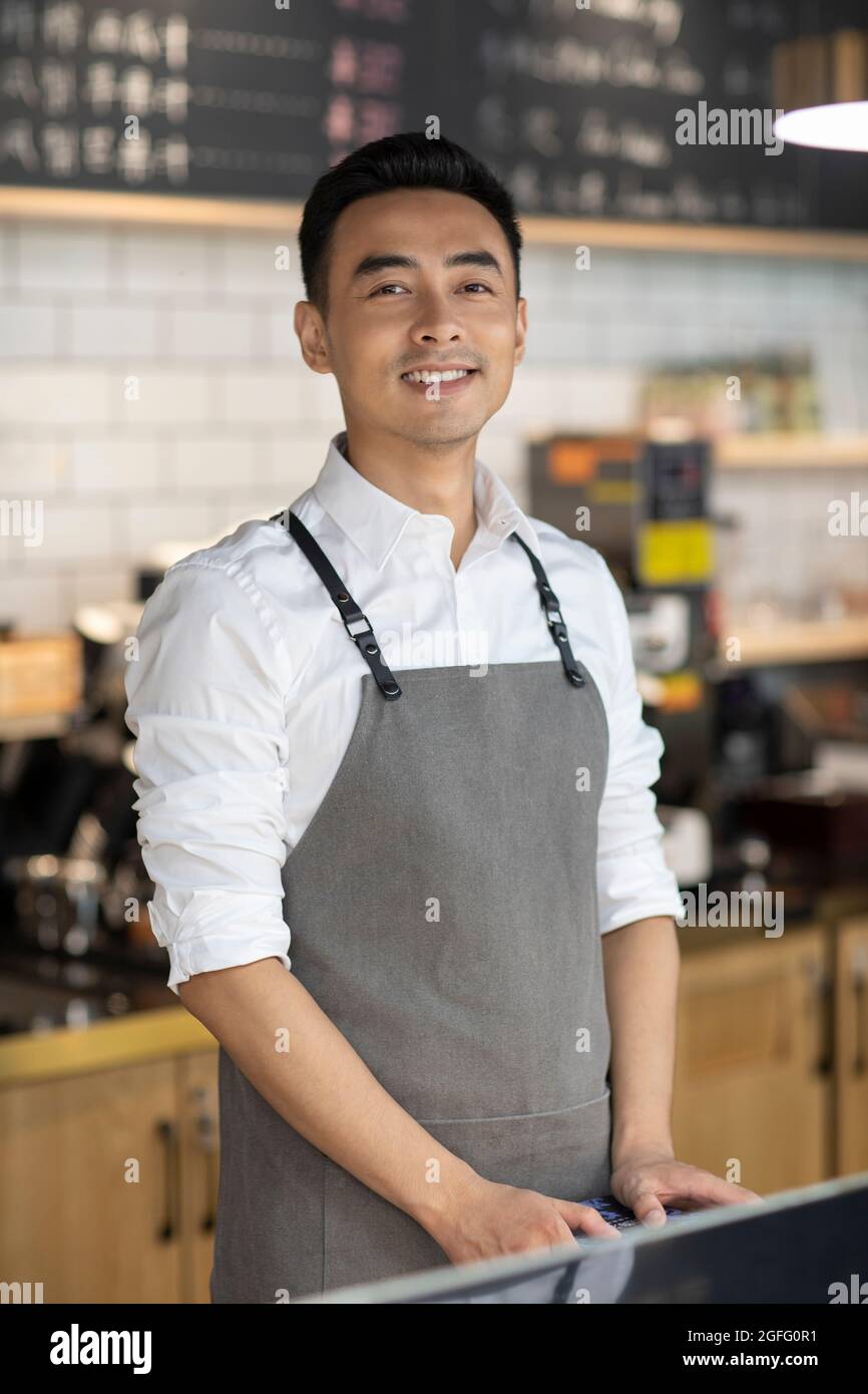 Portrait of coffee shop owner Stock Photo - Alamy