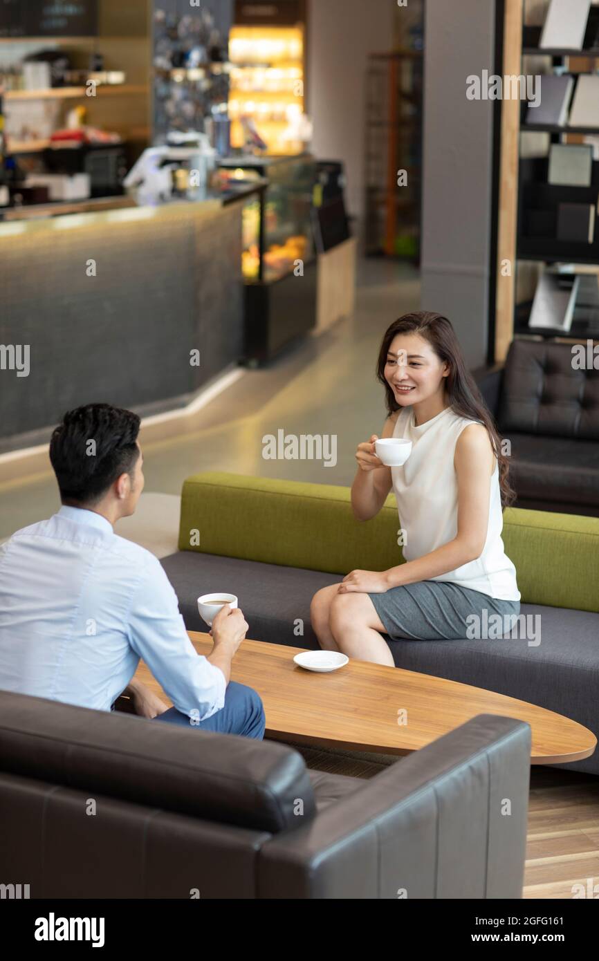 Business people drinking coffee in café Stock Photo - Alamy