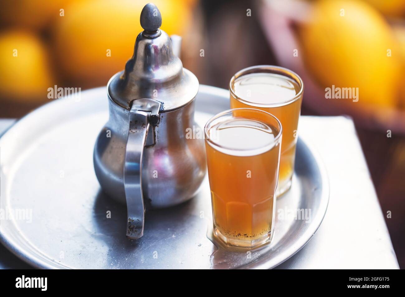 Moroccan tea, kettle and glass of fresh tea, Essaouira, Morocco Stock ...