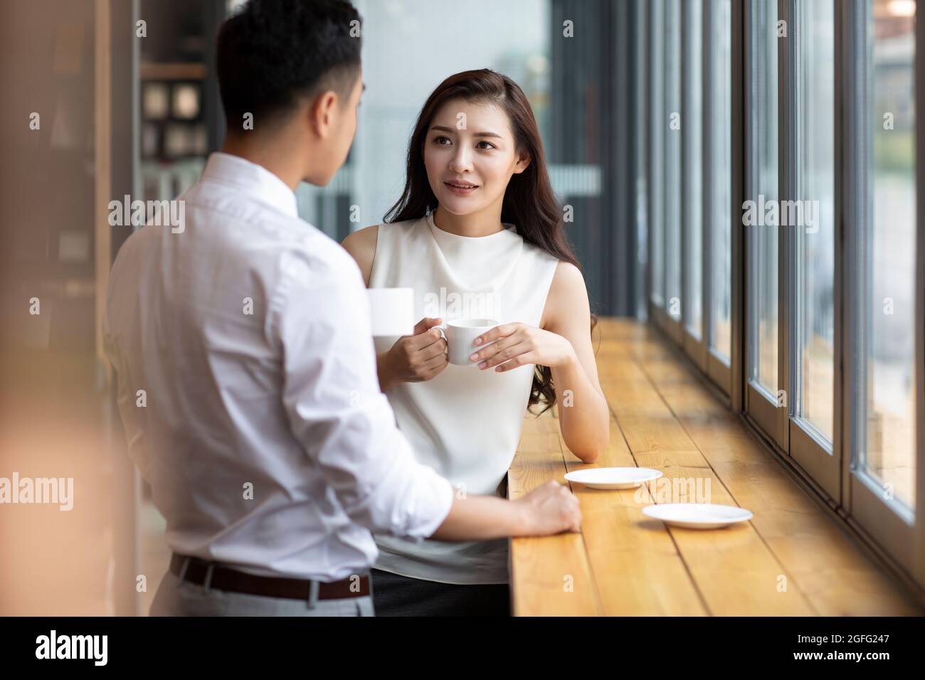 Business people talking in café Stock Photo - Alamy