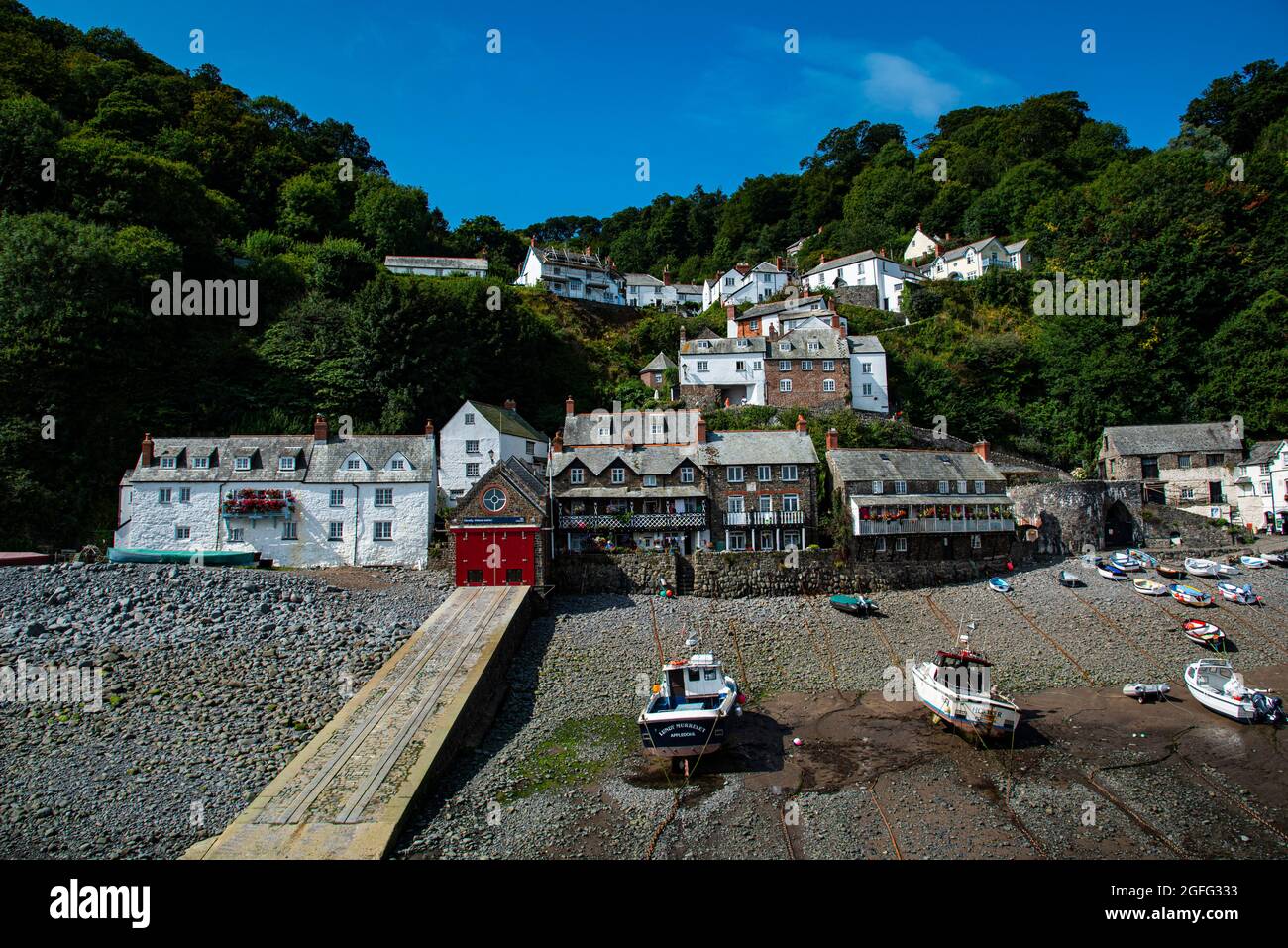 View of the lower part of Clovelly from the harbour wall at low tide ...
