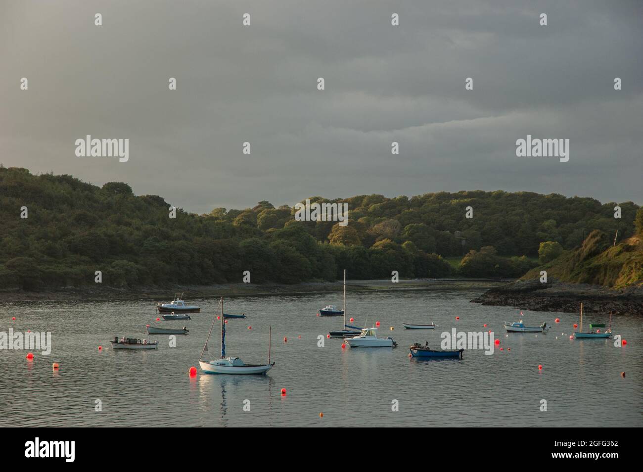 Boat anchorage in the mild light of an Irish summer's evening at ...