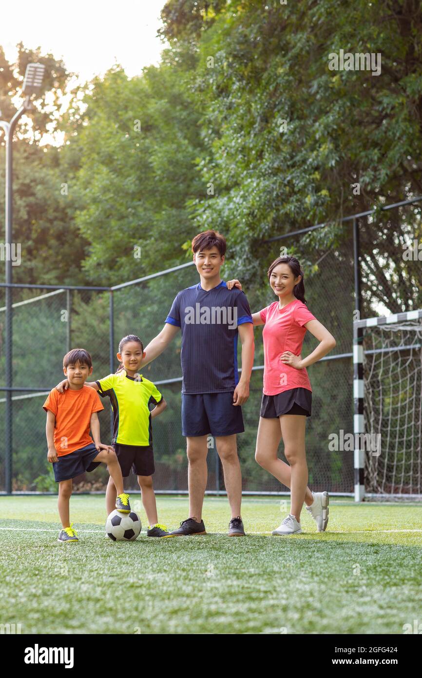 Cheerful mother son football hi-res stock photography and images - Alamy