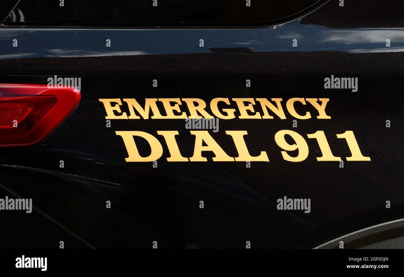 A police car with Emergency Dial 911 parked at an outdoor art show in ...