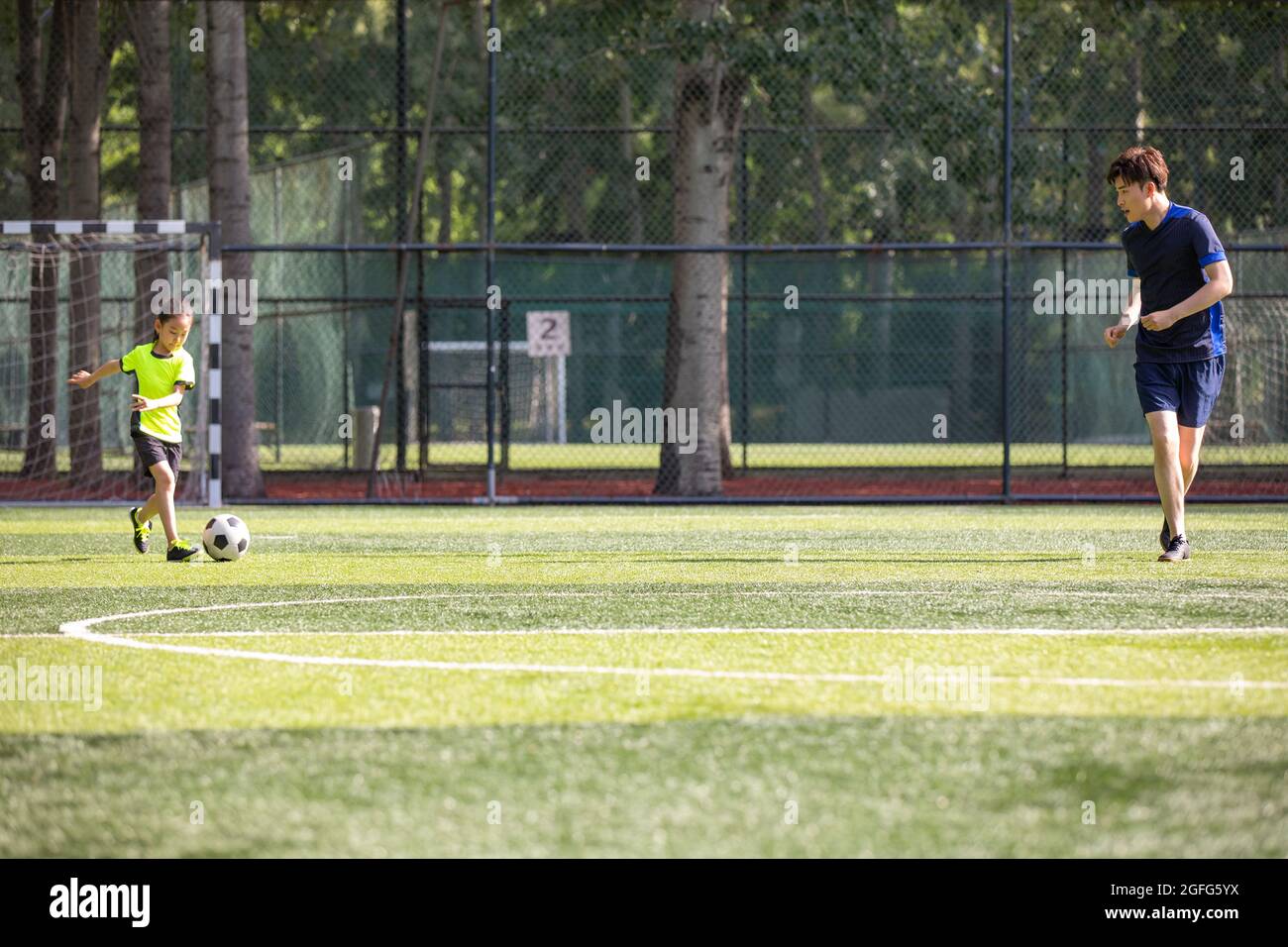 Father and daughter playing football hi-res stock photography and ...