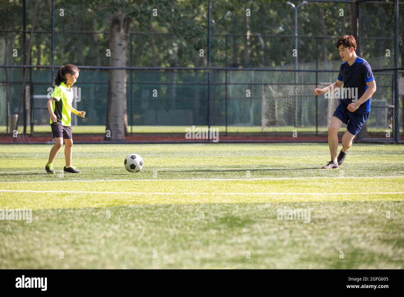 Father and daughter playing football hi-res stock photography and ...