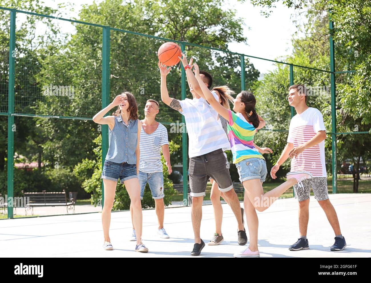 Teenagers playing basketball Stock Photo - Alamy