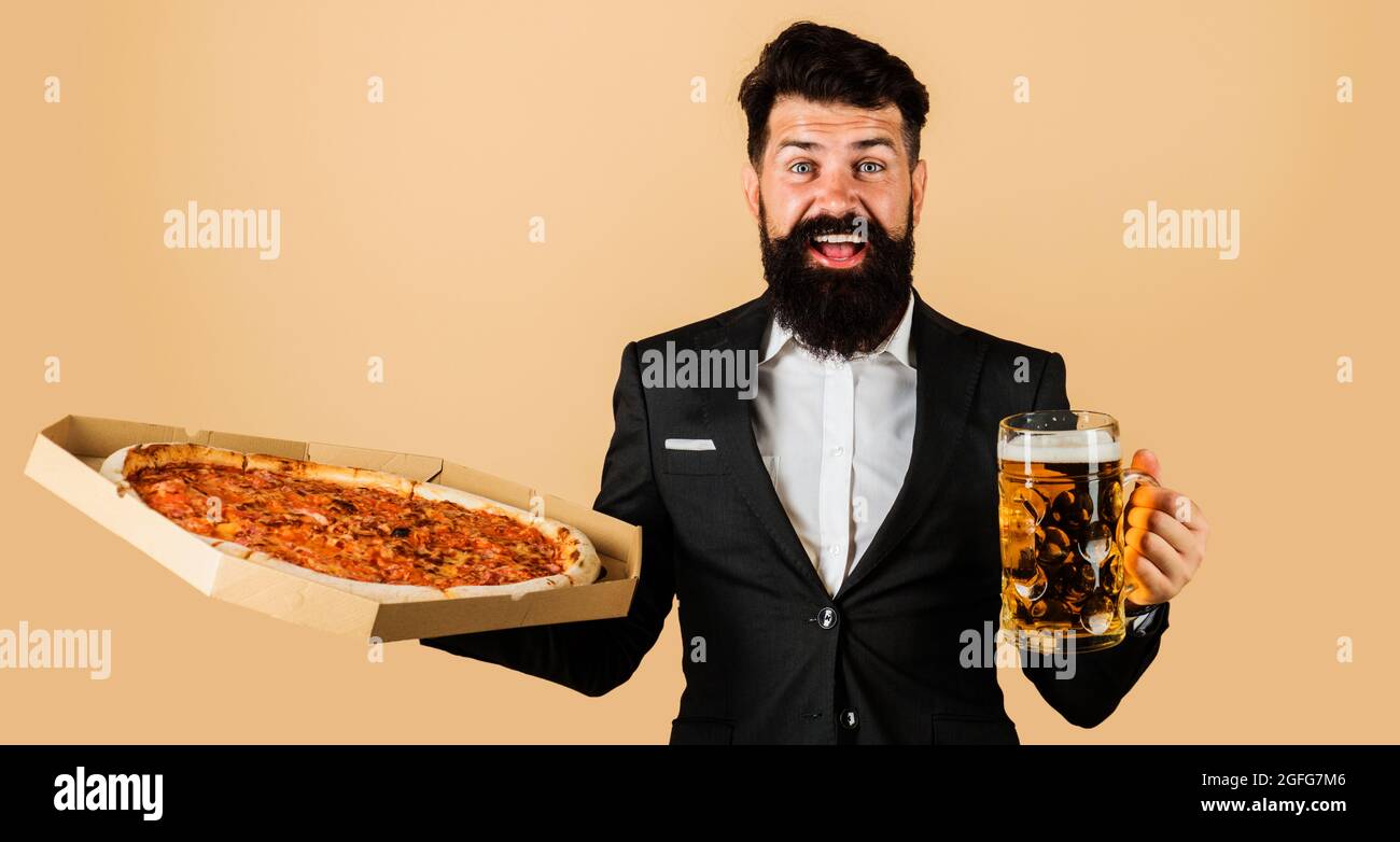 Restaurant or pizzeria. Smiling man with pizza and beer in hands ...