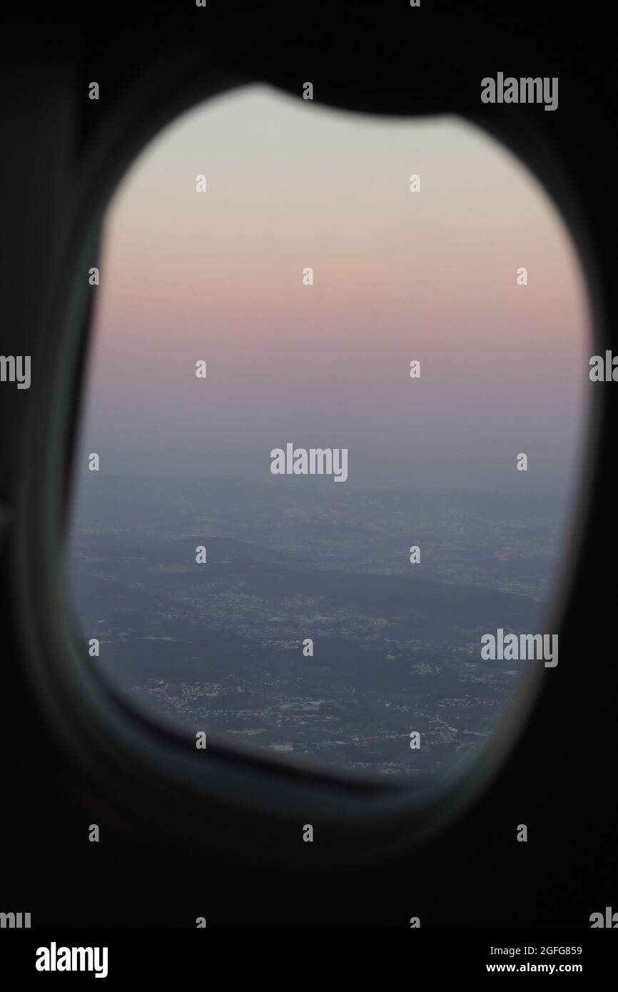 Sunset through the window of an airplane taking off, travel Stock Photo ...