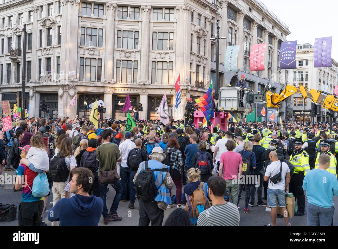 Oxford Circus, London, UK. 25th August 2021. Climate change protesters ...