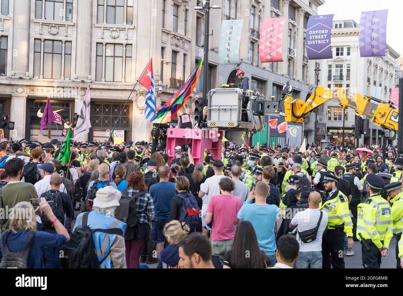 Oxford Circus, London, UK. 25th August 2021. Climate change protesters ...