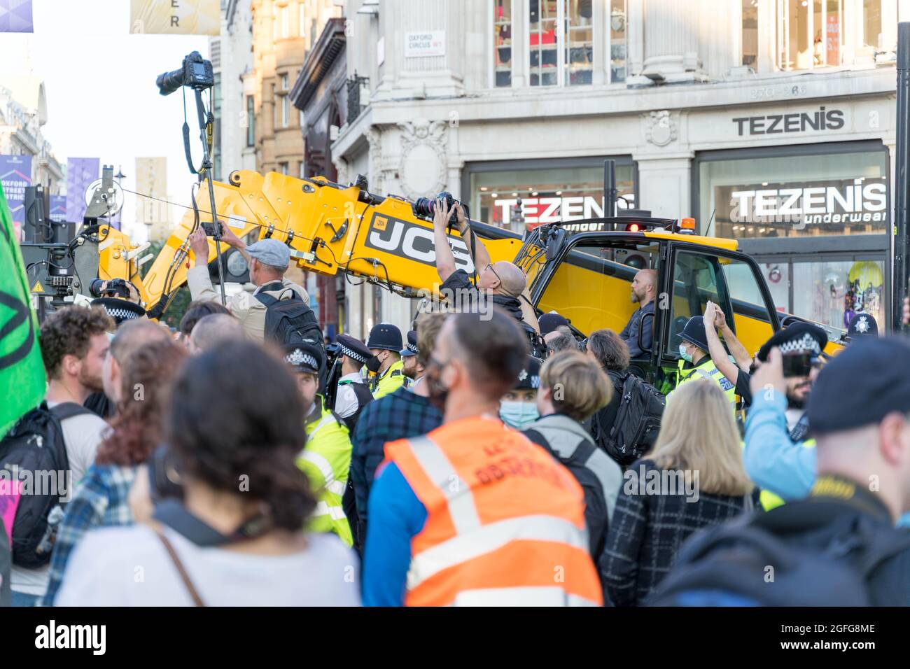 Oxford Circus, London, UK. 25th August 2021. Climate change protesters ...