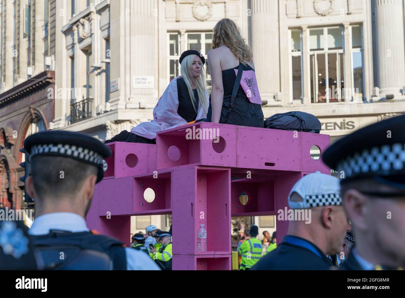 Oxford Circus, London, UK. 25th August 2021. Climate change protesters ...