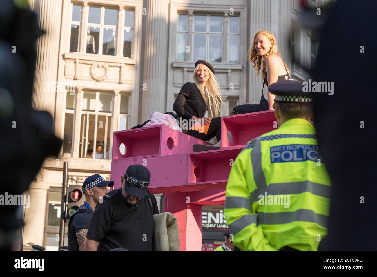 Oxford Circus, London, UK. 25th August 2021. Climate change protesters ...