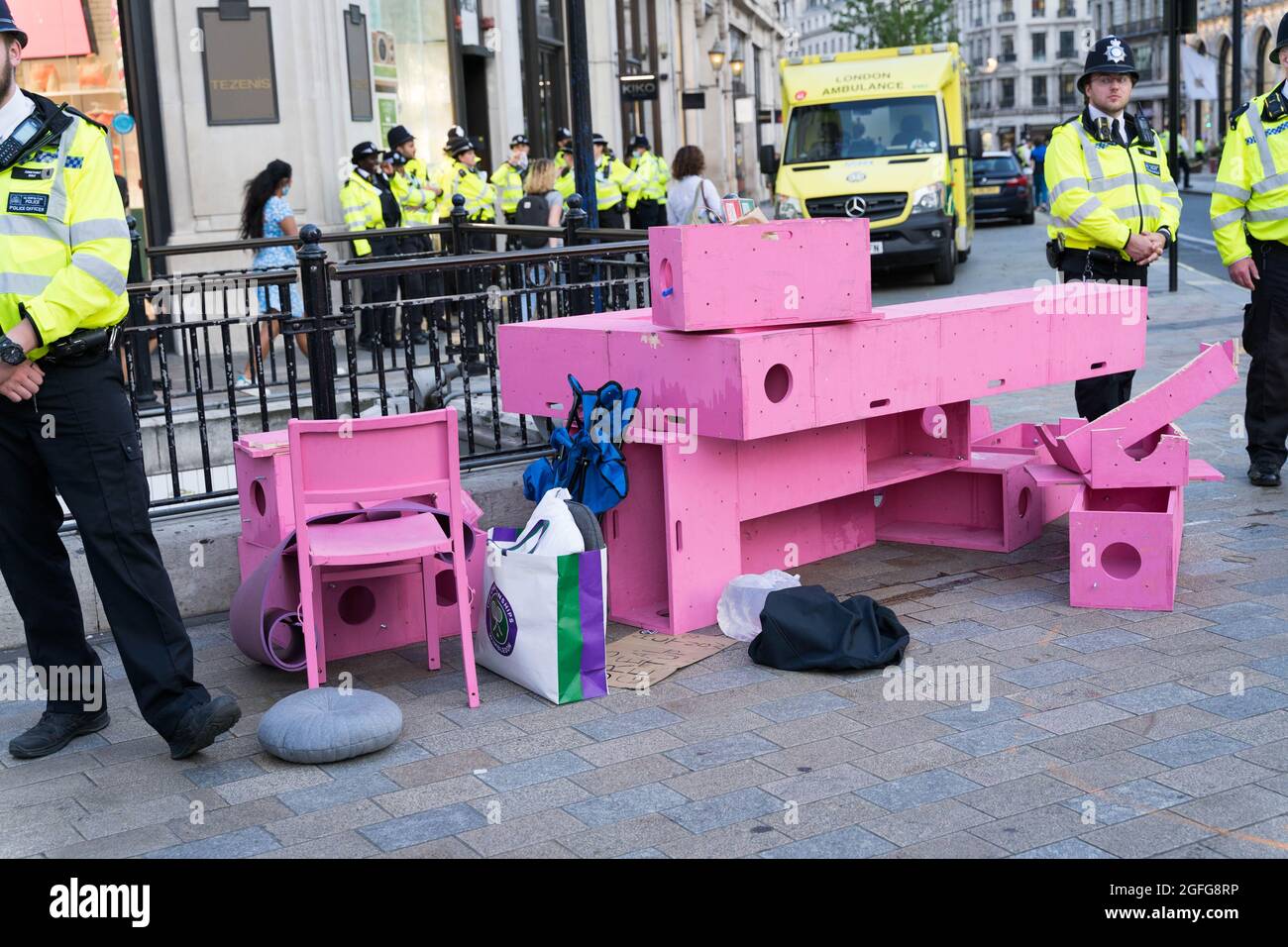 Oxford Circus, London, UK. 25th August 2021. Climate change protesters ...