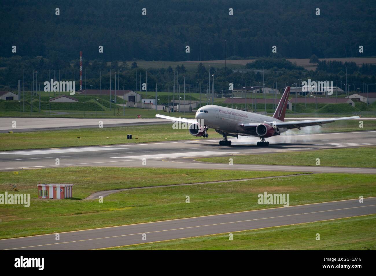 A commercial airline lands at Spangdahlem Air Base, Germany, Aug. 23 ...