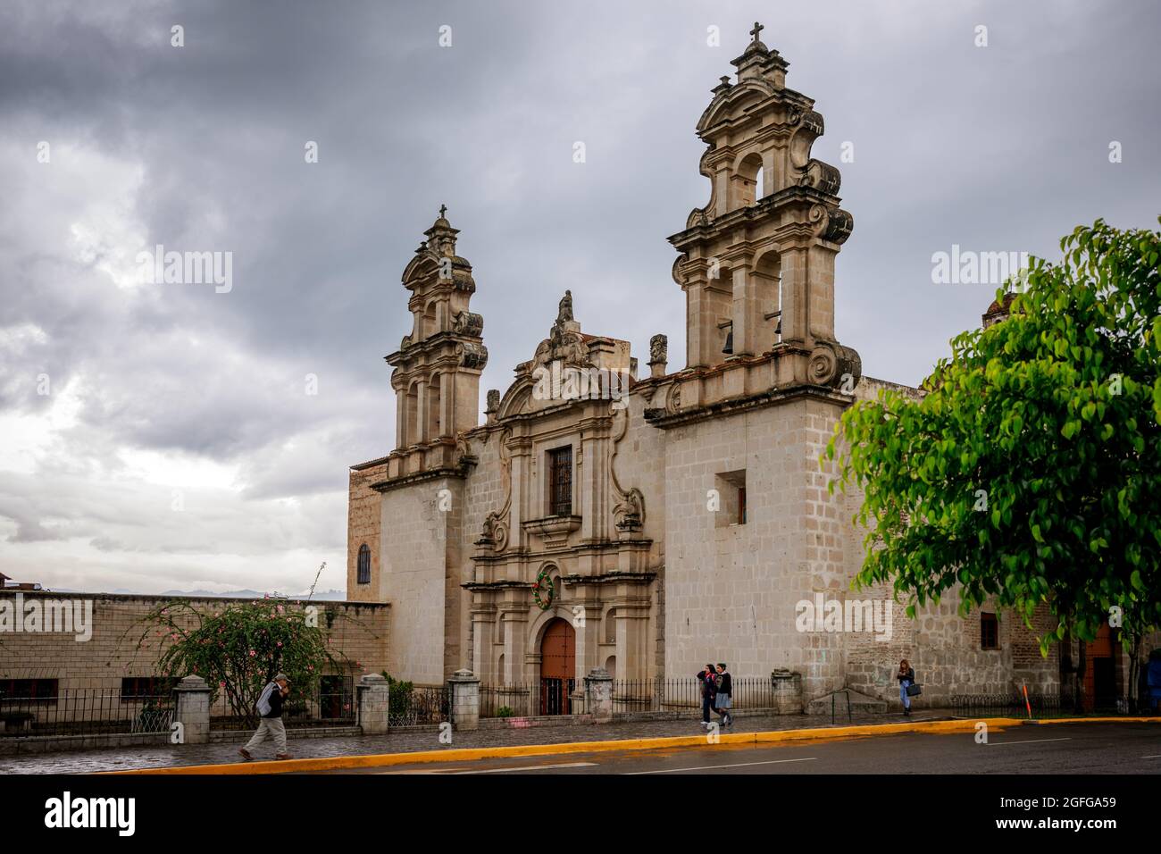 Cajamarca, Cajamarca/Peru - 16.12.2019: Peruvian locals passing by the ...