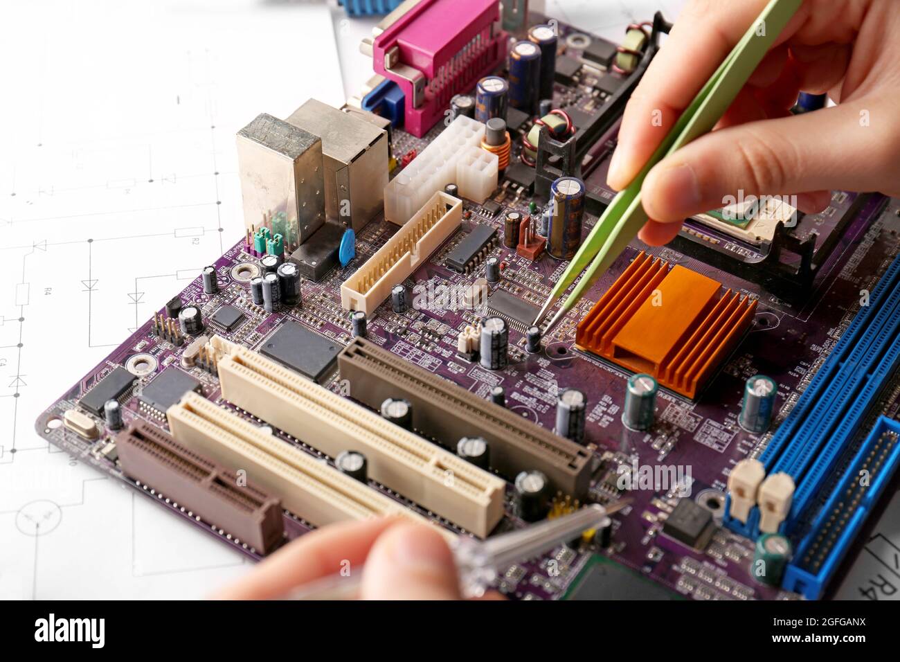 Man repairing motherboard, closeup Stock Photo - Alamy
