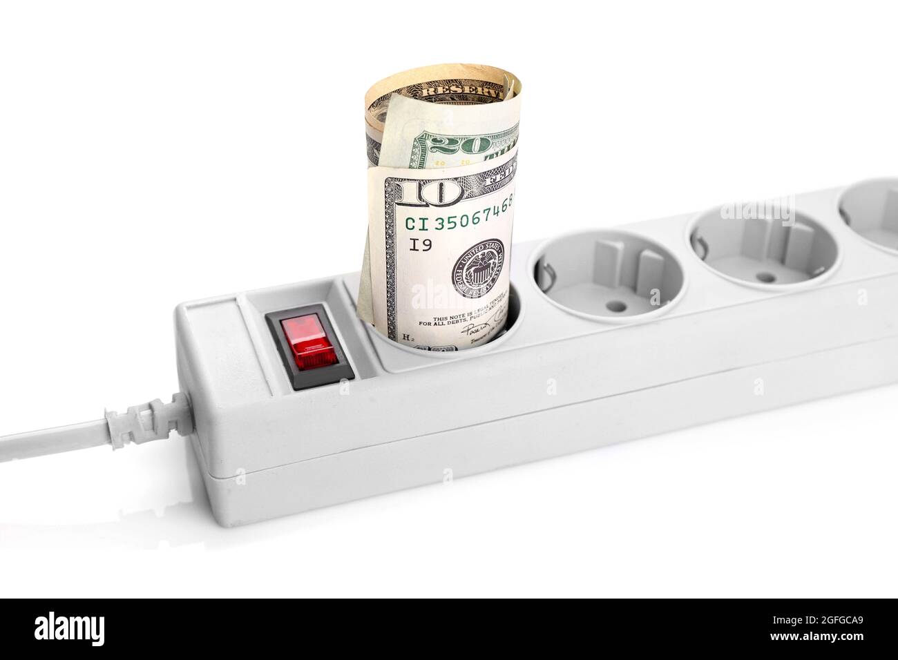 Dollars in power socket on white background Stock Photo - Alamy