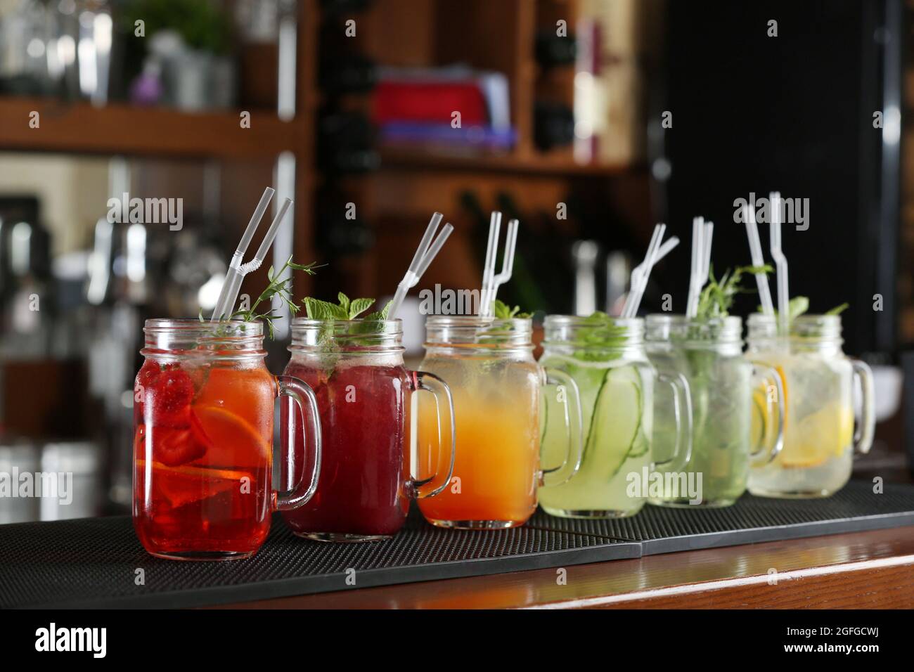 Different cocktails on table in cafe Stock Photo - Alamy