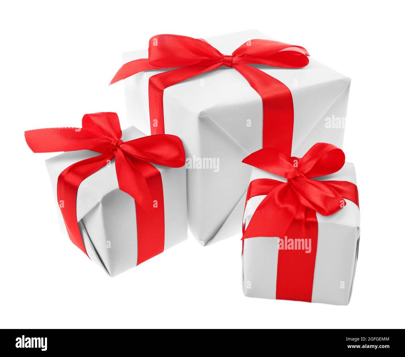 Gift boxes with red ribbon isolated on white Stock Photo - Alamy