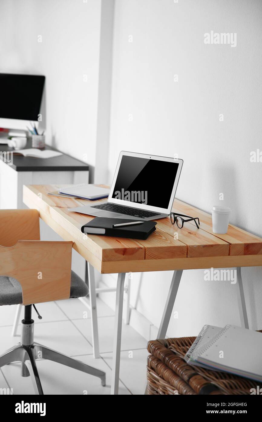 Working place on white wall background Stock Photo - Alamy