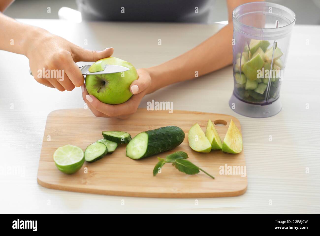 Girl cutting vegetables and fruits on kitchen Stock Photo - Alamy