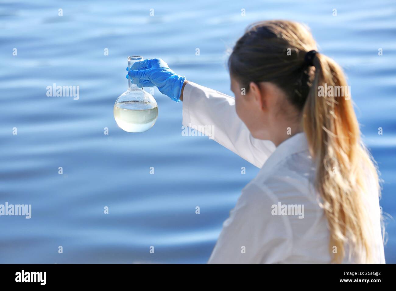 Woman with flask for expertise. Environmental pollution concept Stock ...