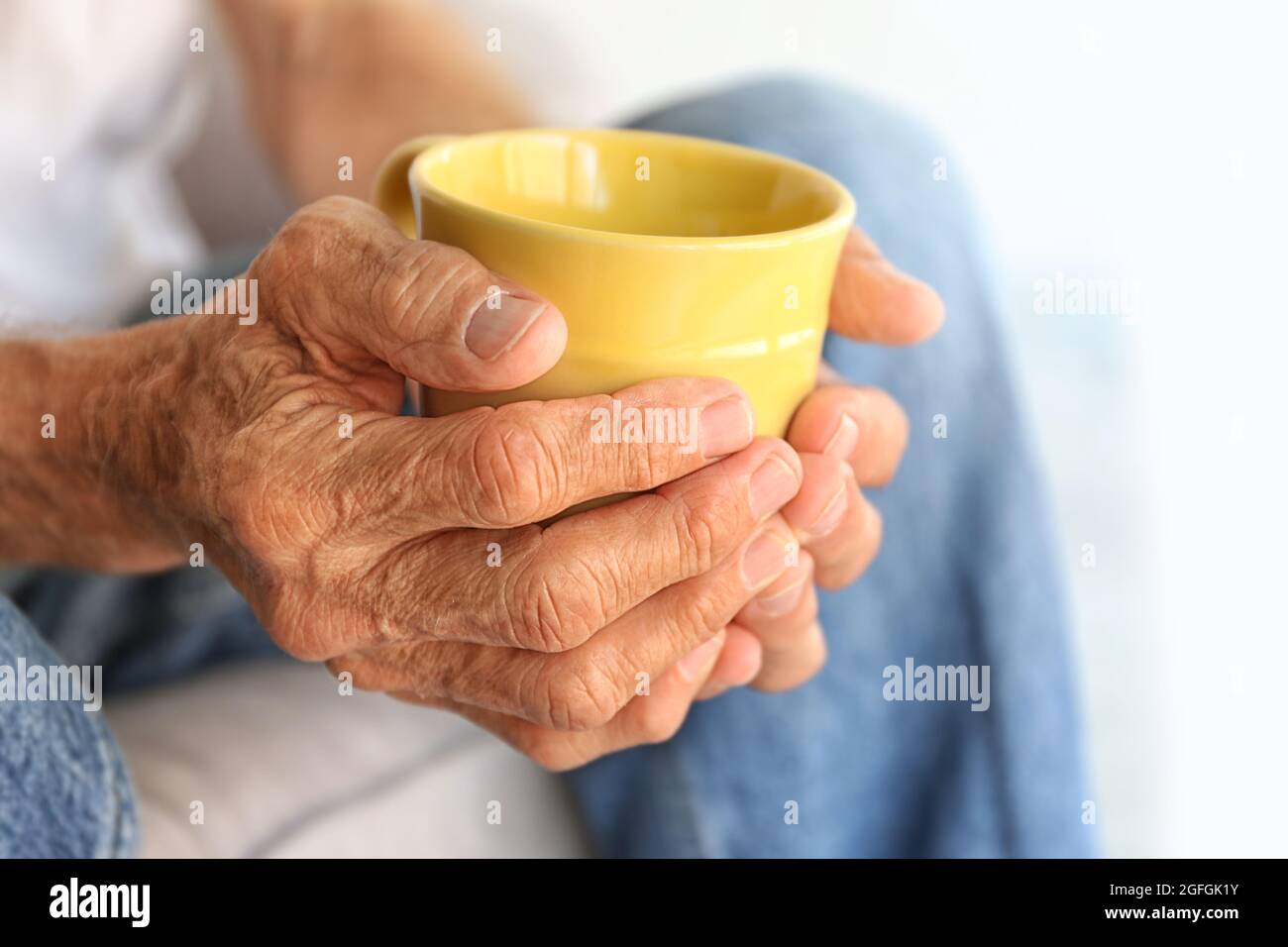 Tired senior man holding coffee hi-res stock photography and images - Alamy