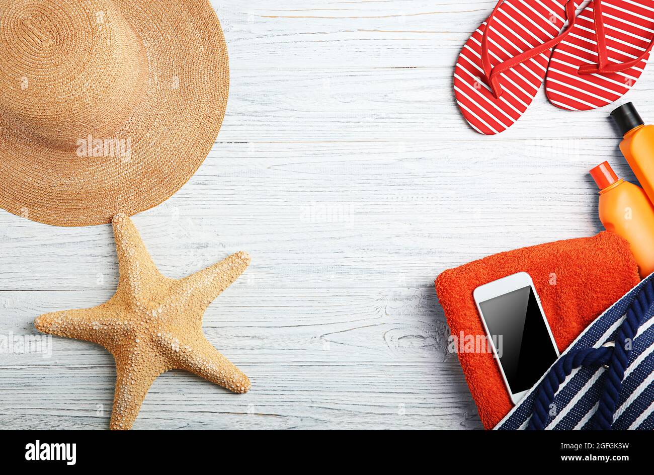 Sun protection accessories on wooden background Stock Photo - Alamy