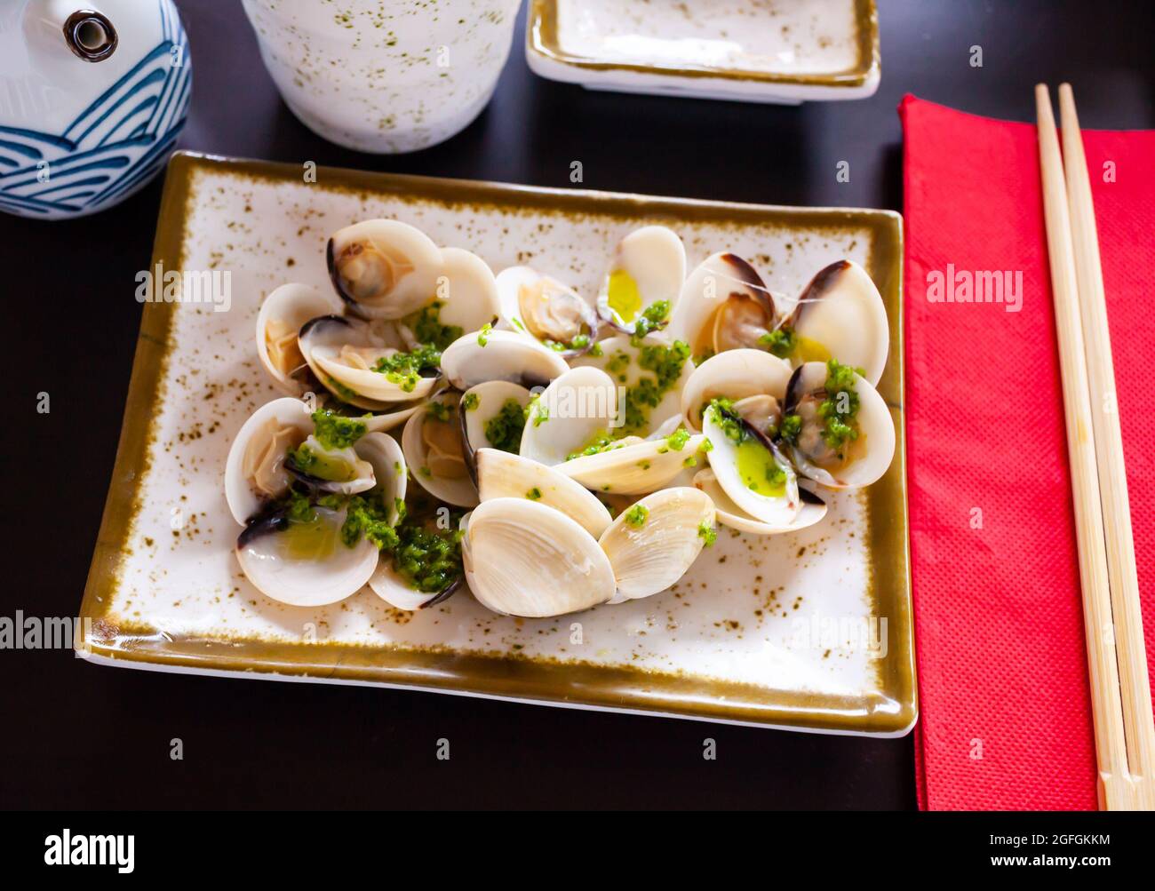 Japanese steamed clams with butter, sake, mirin and scallion Stock ...