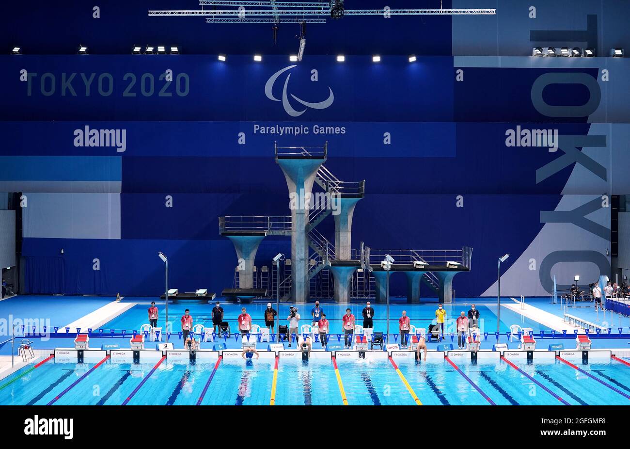 Competitors dive in pool start mens 100m freestyle hi-res stock ...