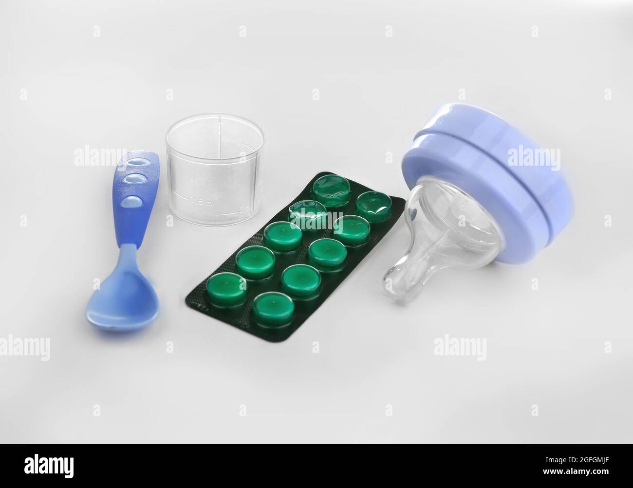 Baby care concept. Baby bottle and pills on white background Stock ...