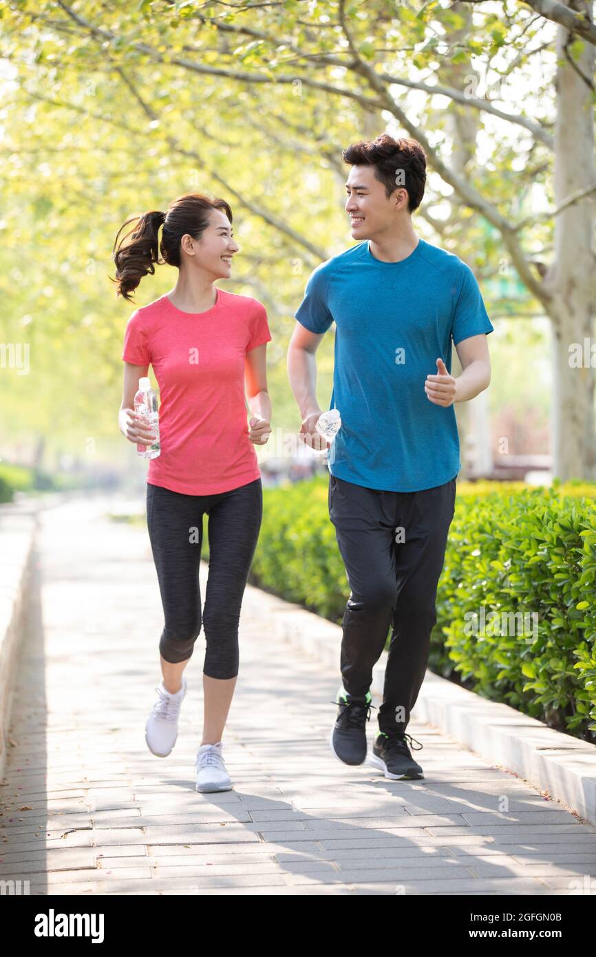 Two people running drink hi-res stock photography and images - Alamy