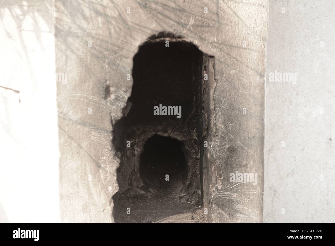 chimney hole in the wall - Image shade of gray Stock Photo - Alamy