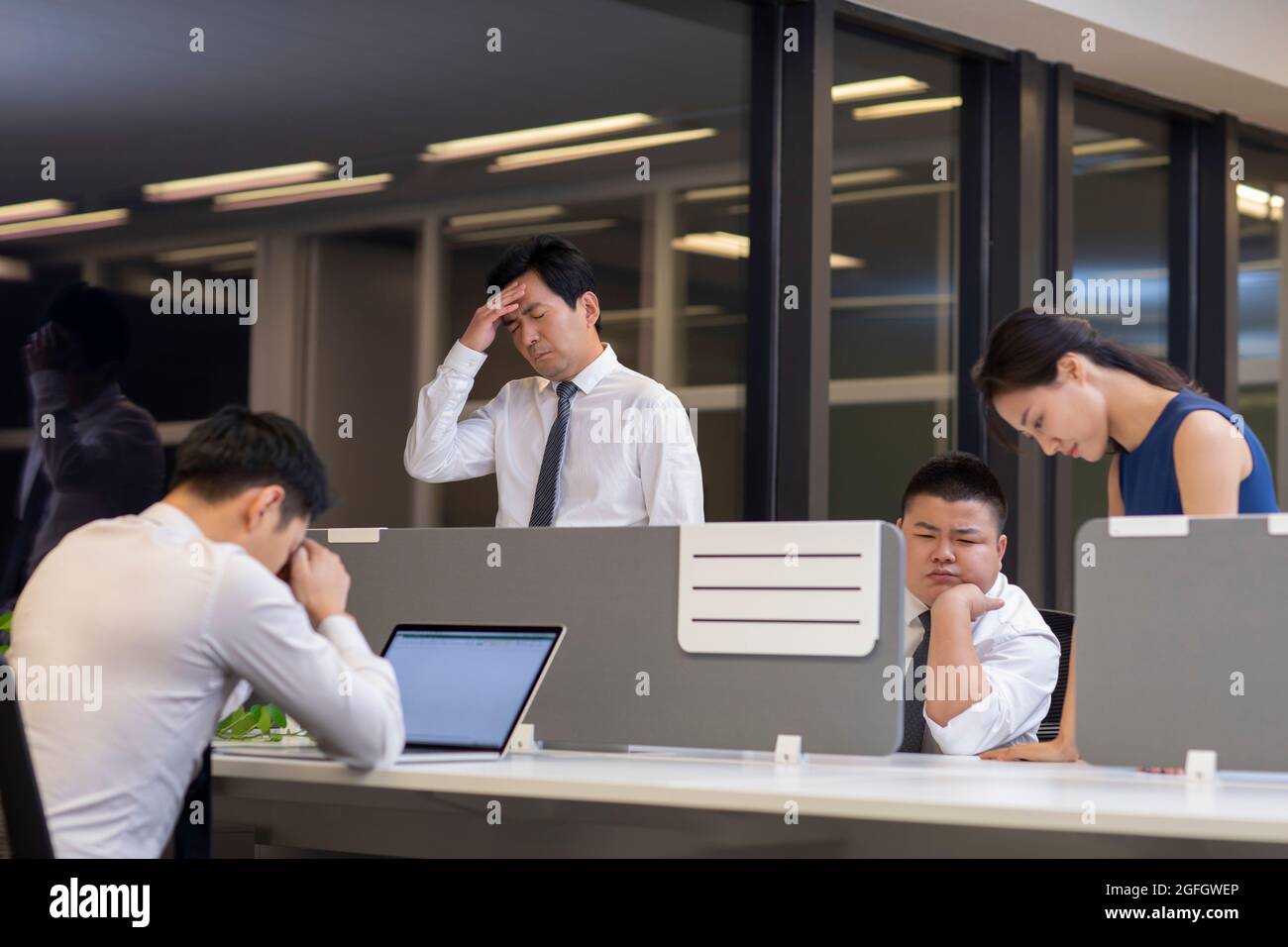 Business people working late in office Stock Photo - Alamy