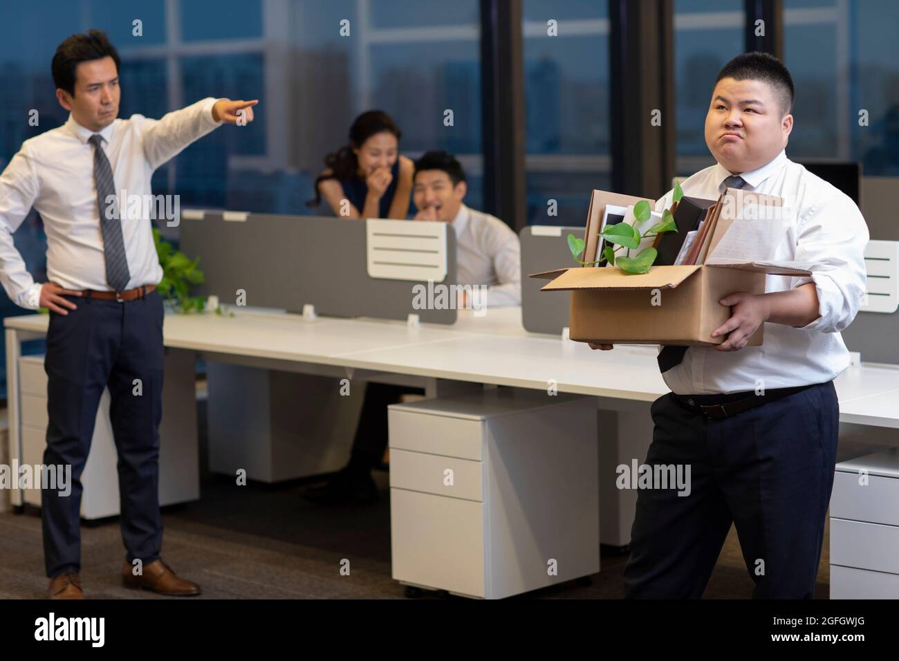 Bossy manager firing employee Stock Photo - Alamy