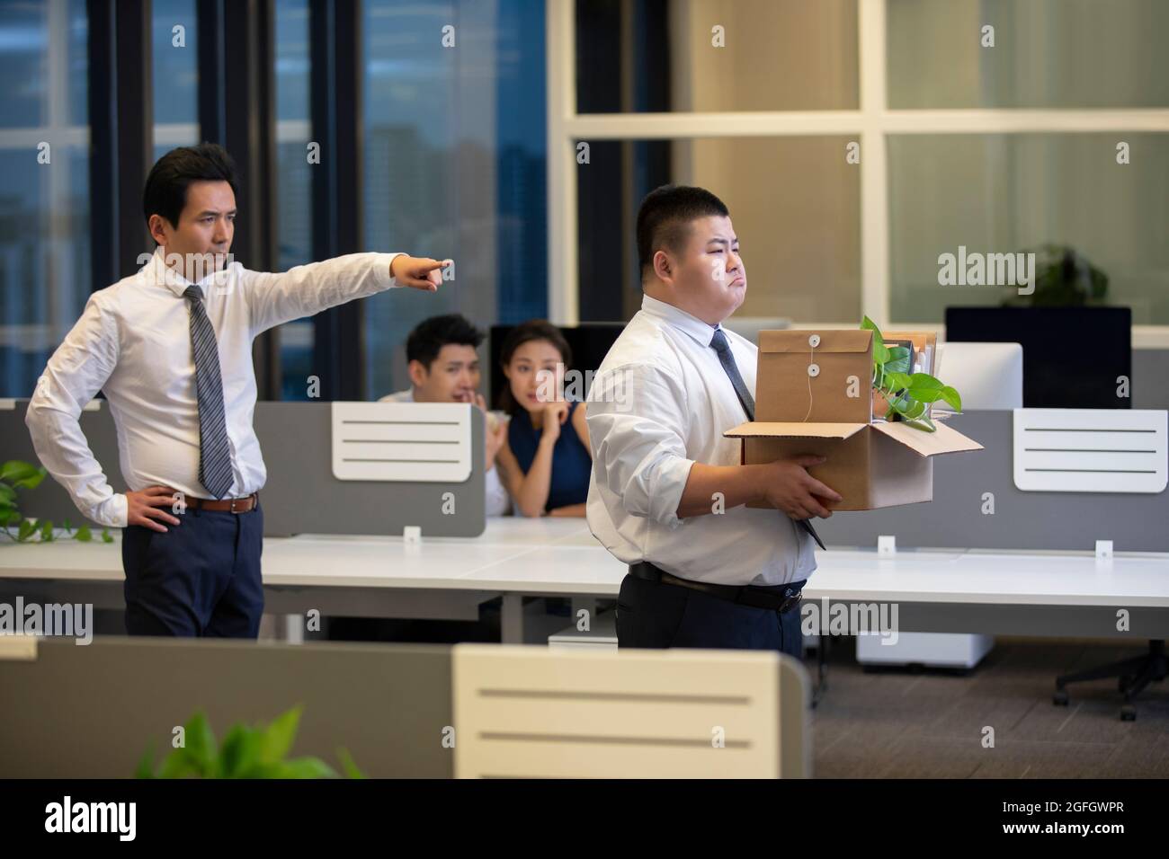 Bossy manager firing employee Stock Photo - Alamy