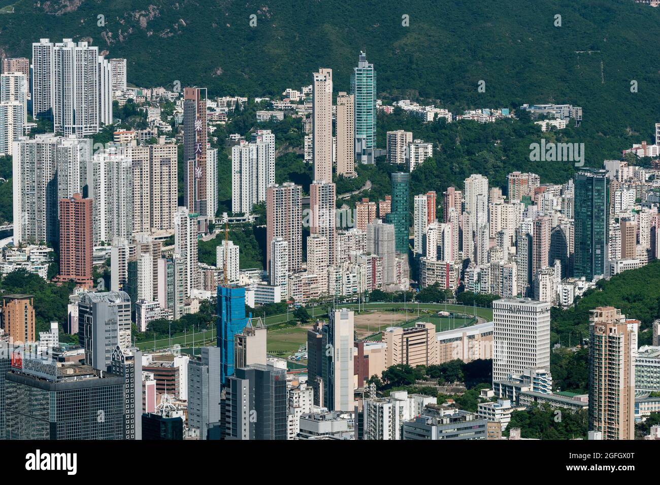 The high-rise residential apartment blocks of Happy Valley behind the commercial buildings of ...